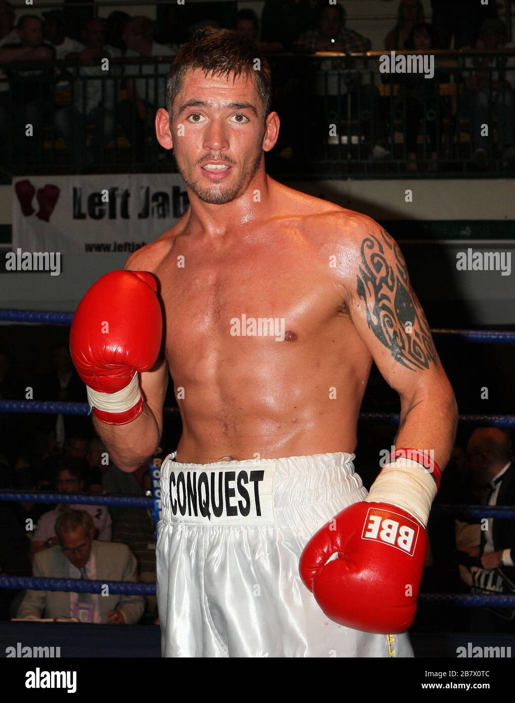 Tony Conquest, Tony Conquest (white shorts) defeats Bobby Scott in a ...