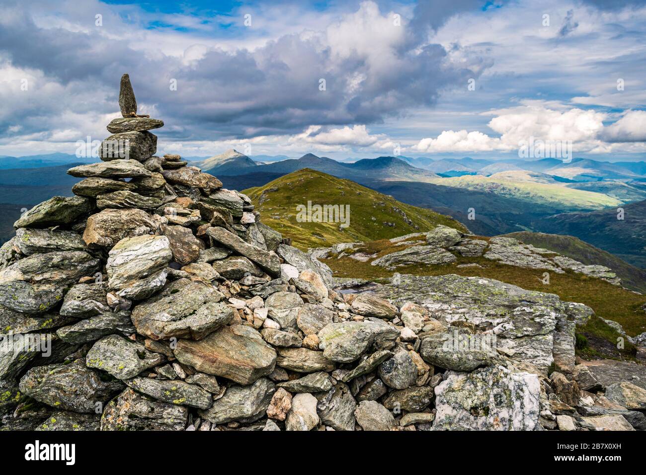 Cairn marking the peak of Ben Vorlich with the scenic Scottish ...