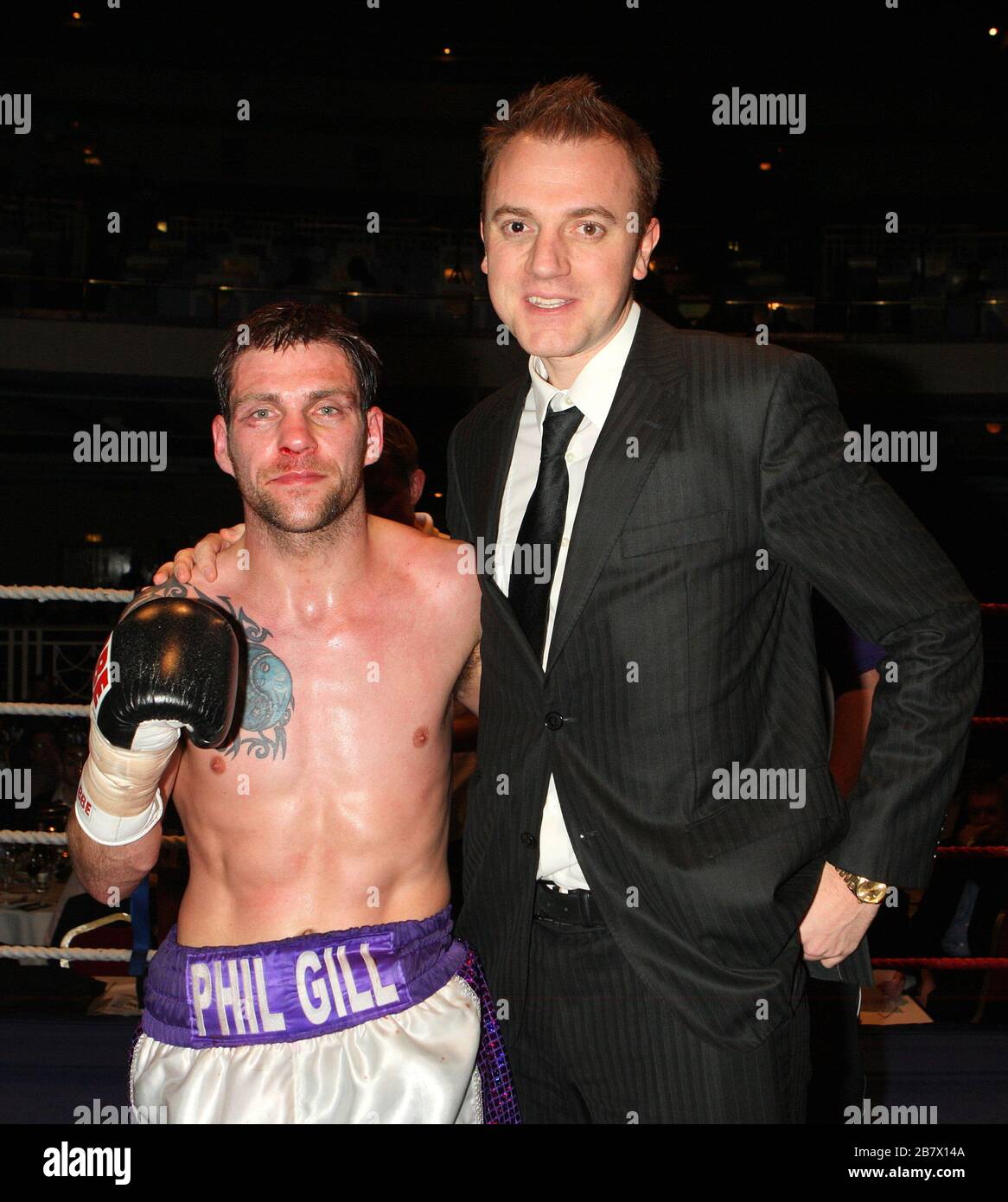 Phil Gill (L) pictured with Mickey Helliet, Phil Gill (white/purple shorts) defeats Kristian ...