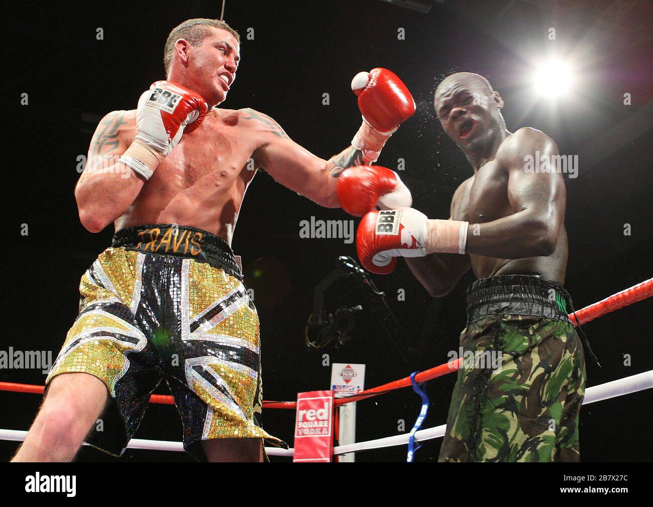 Travis Dickinson (yellow/black shorts) defeats Hastings Rasani in a ...