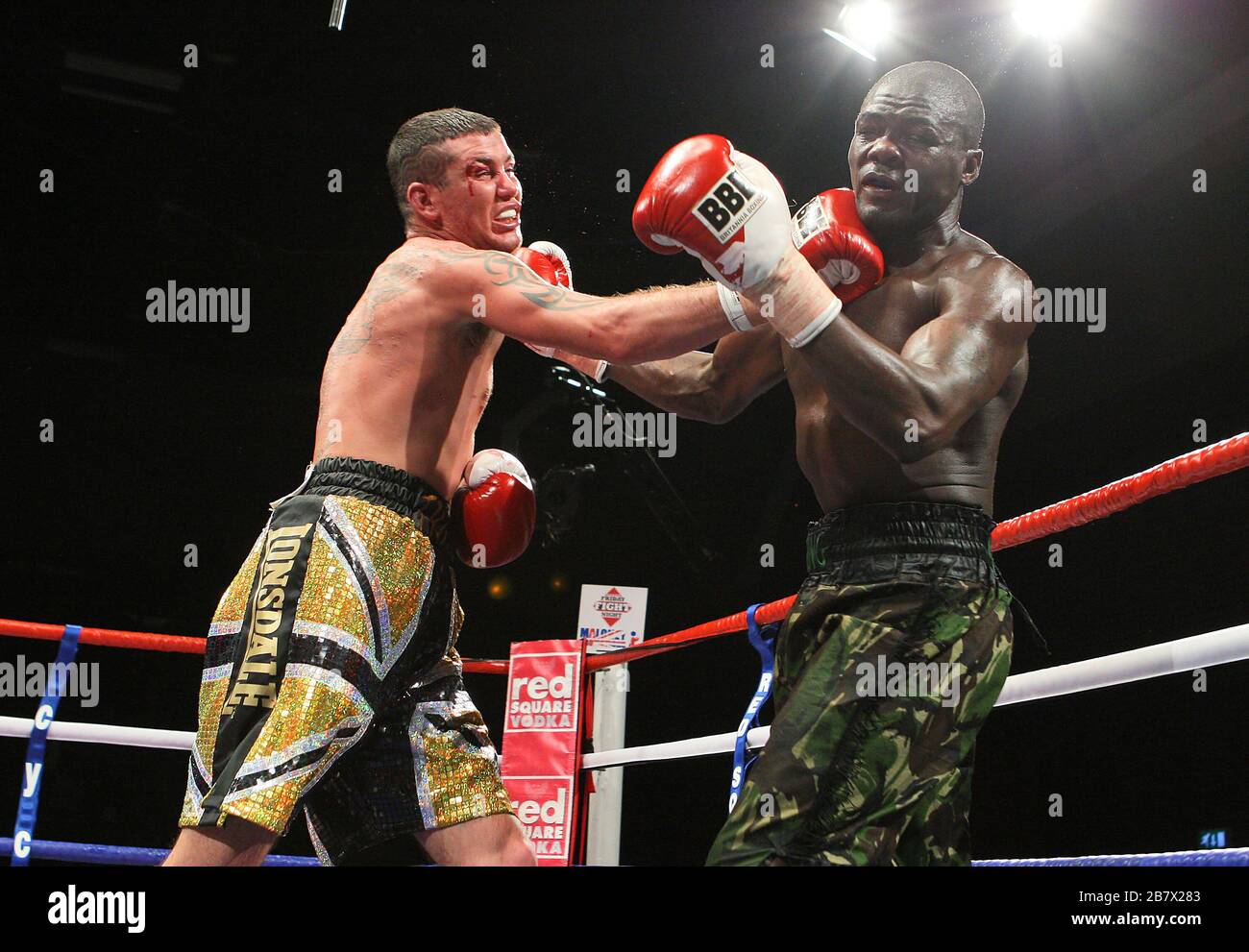 Travis Dickinson (yellow/black shorts) defeats Hastings Rasani in a ...