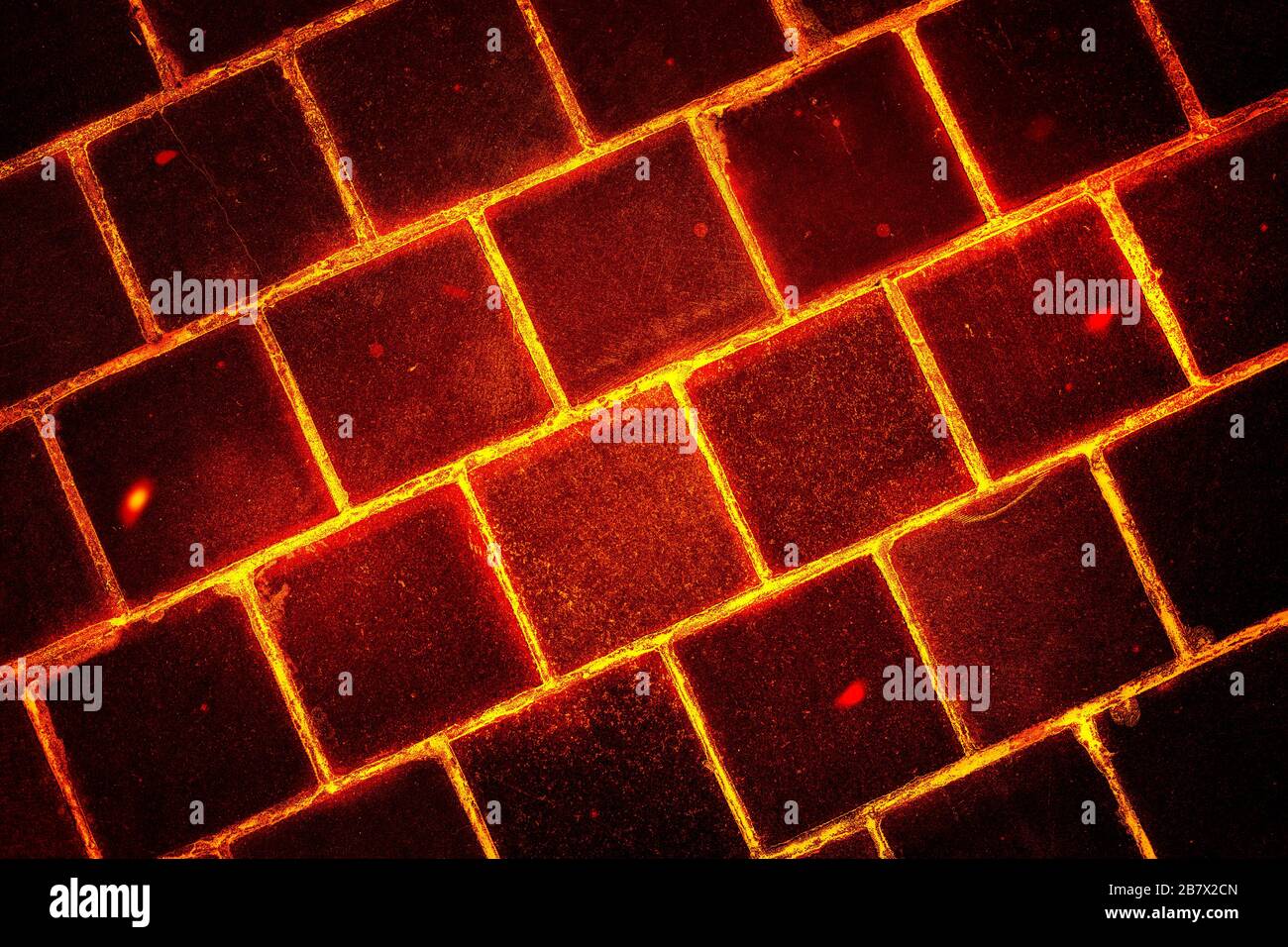 Abstract background of stone texture and hot lava between the seams ...