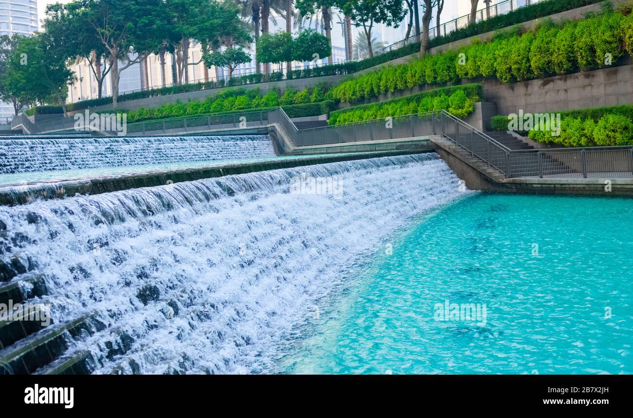 Abstract background. Water flows down the stairs to the pool. Landscape ...