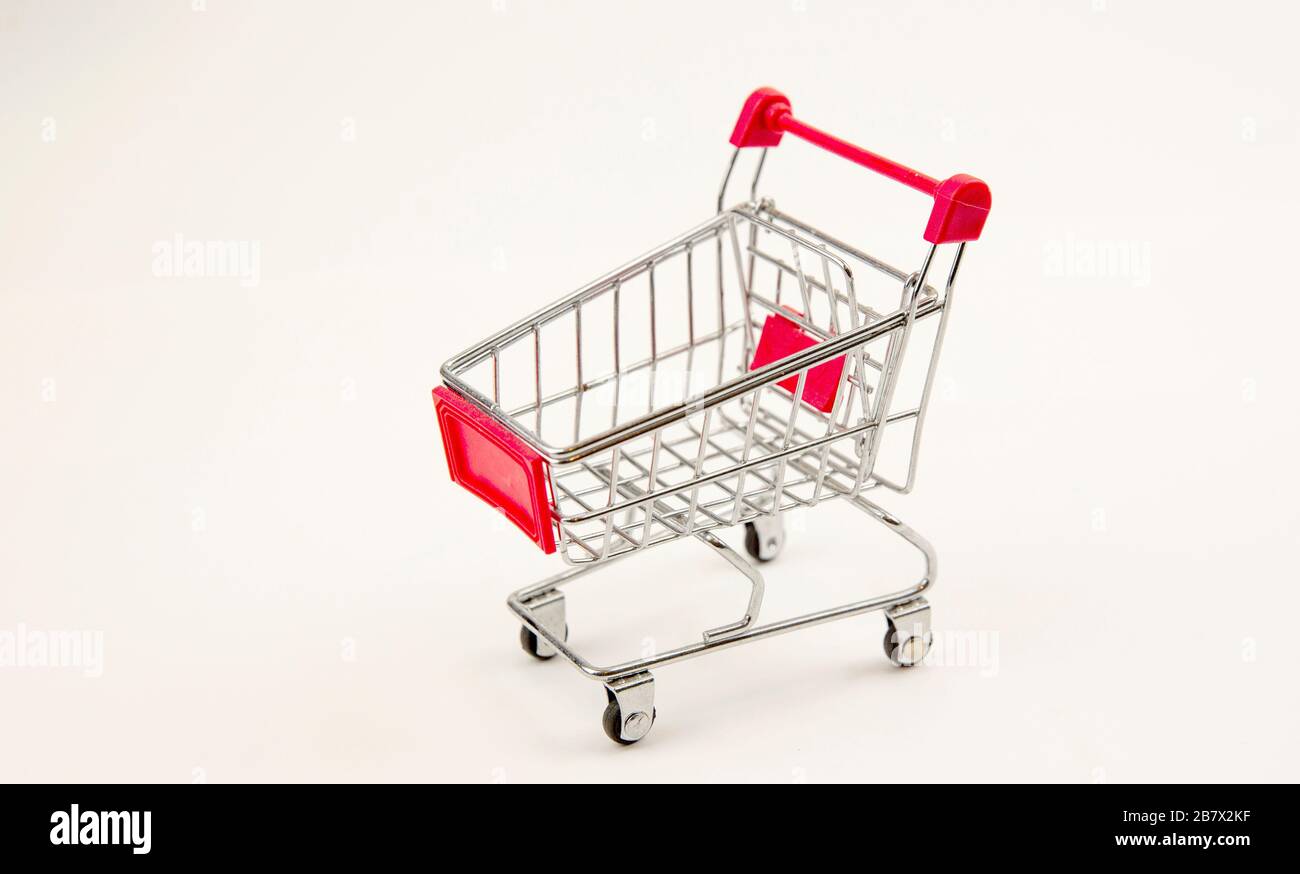 Shopping cart on a white background Stock Photo - Alamy