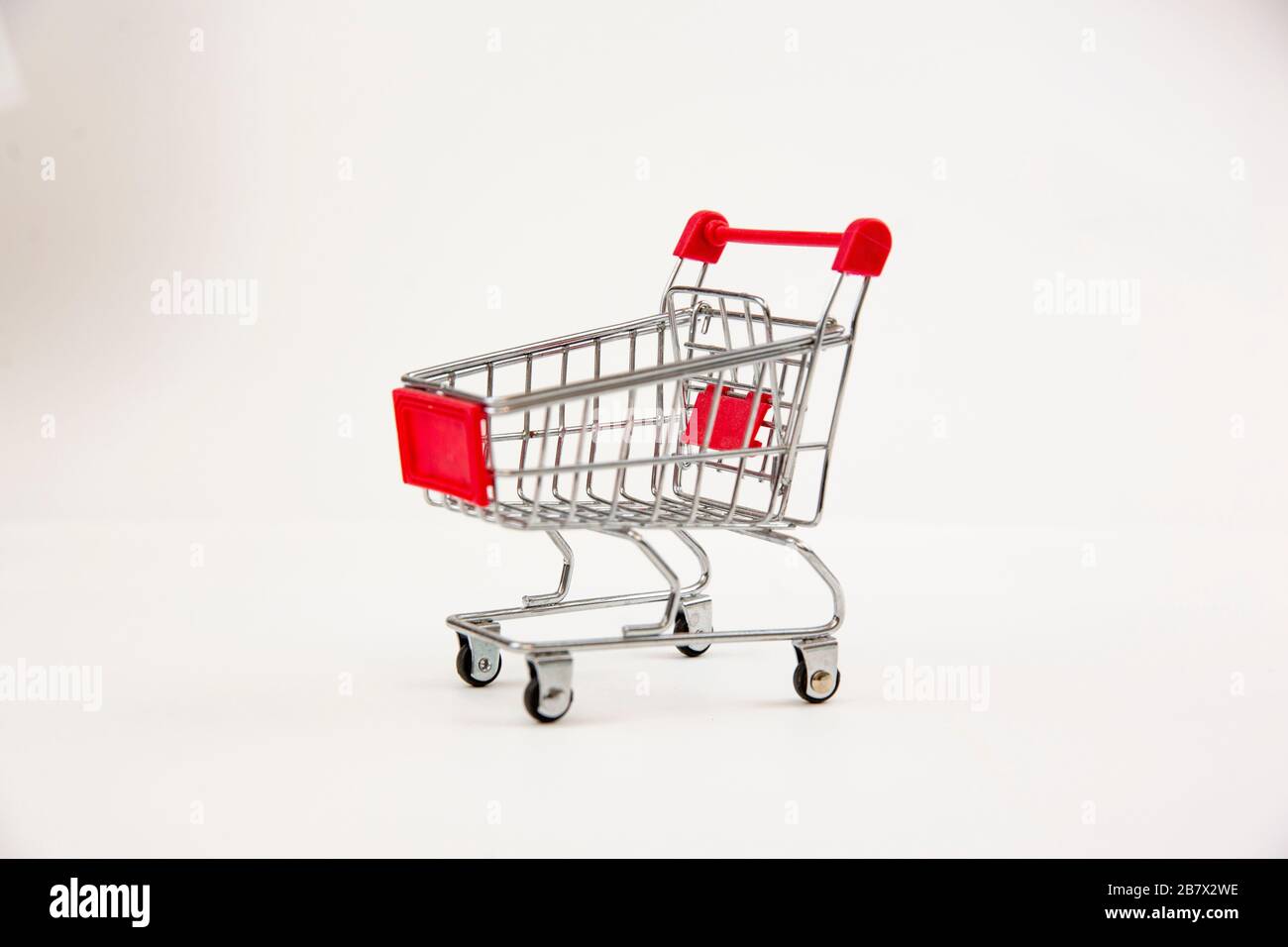 Shopping cart on a white background Stock Photo - Alamy