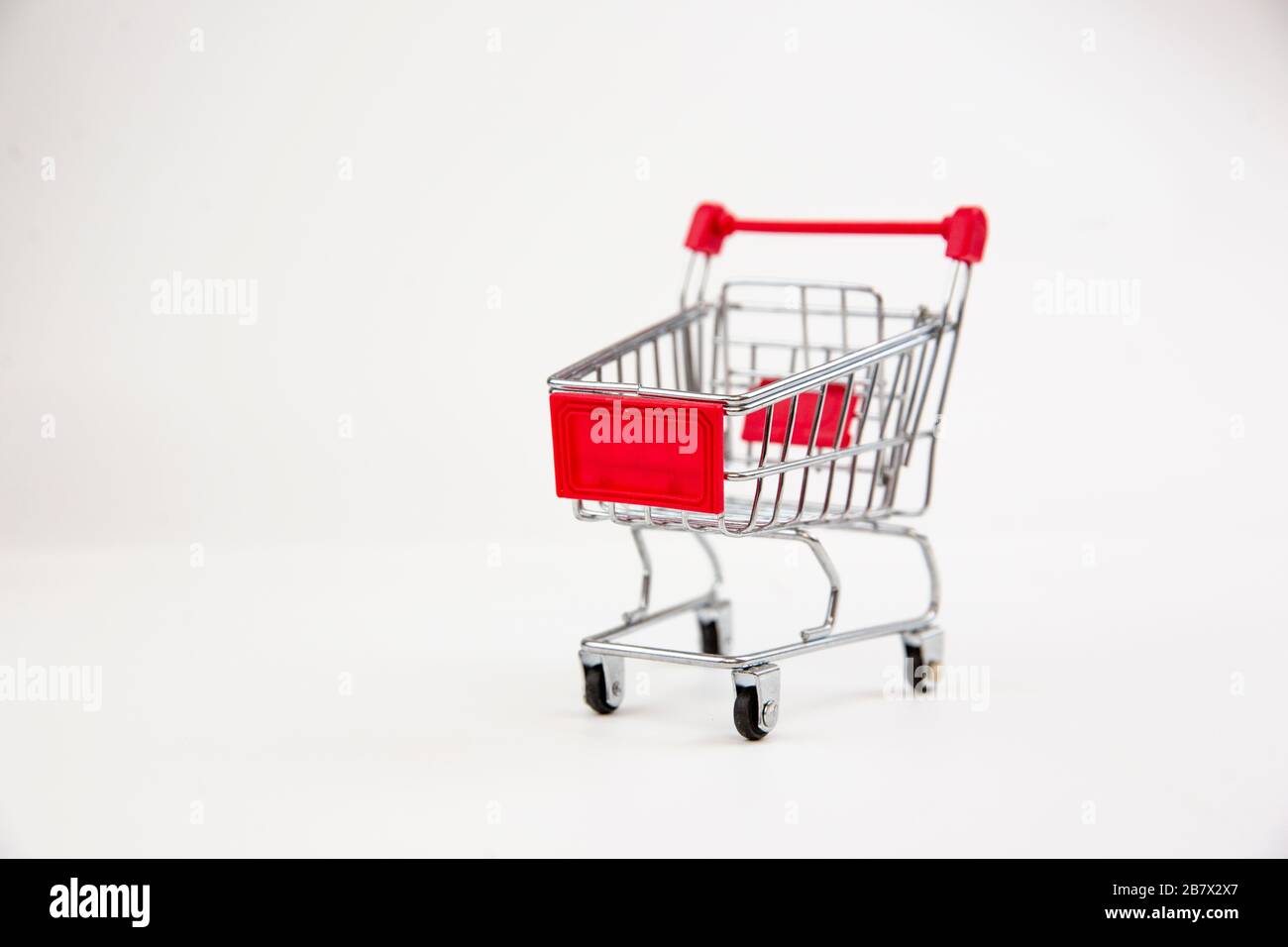 Shopping cart on a white background Stock Photo - Alamy