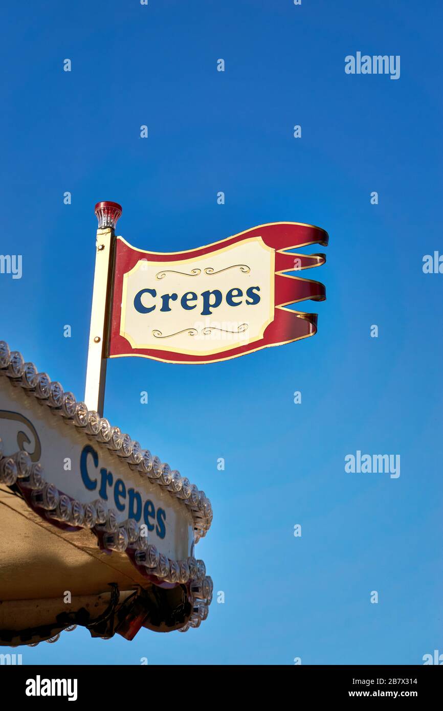 Crepes as text on a sign with blue sky in the background Stock Photo ...