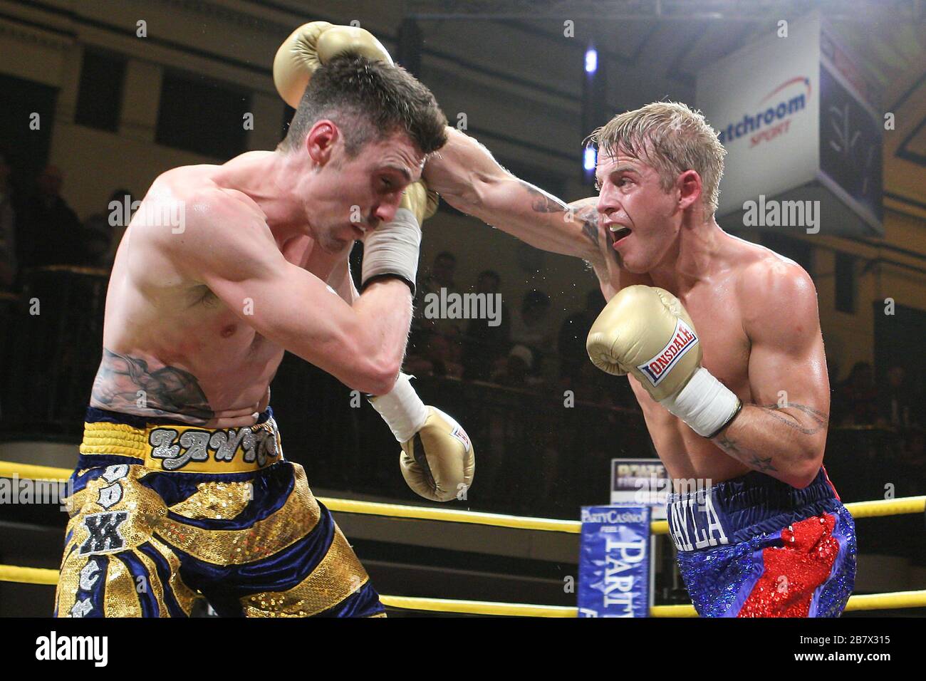 Gary Sykes (blue/red shorts) defeats Scott Lawton (gold/blue shorts) in ...