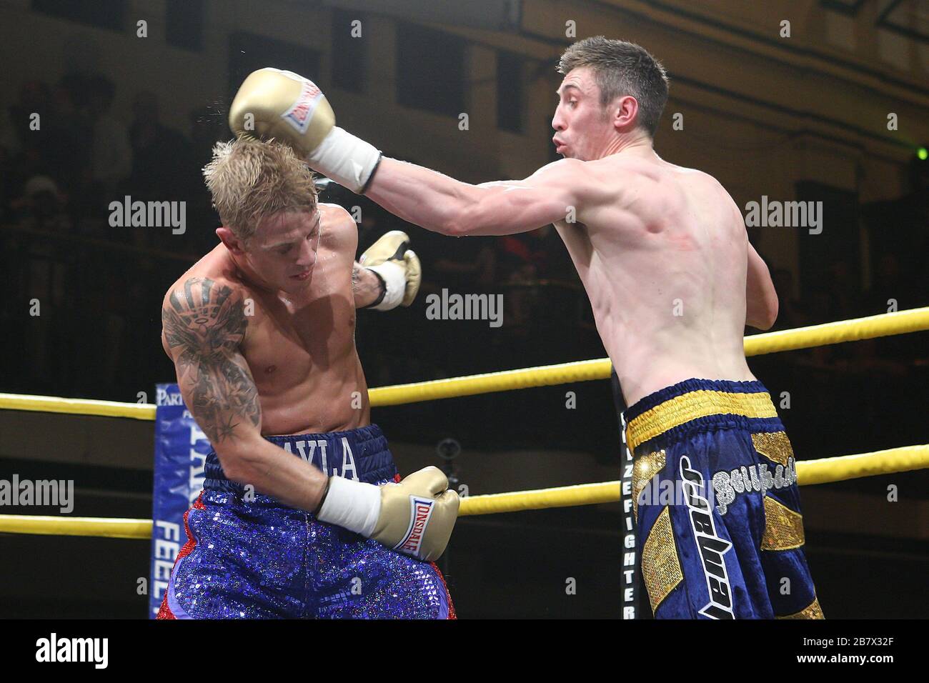 Gary Sykes (blue/red shorts) defeats Scott Lawton (gold/blue shorts) in ...