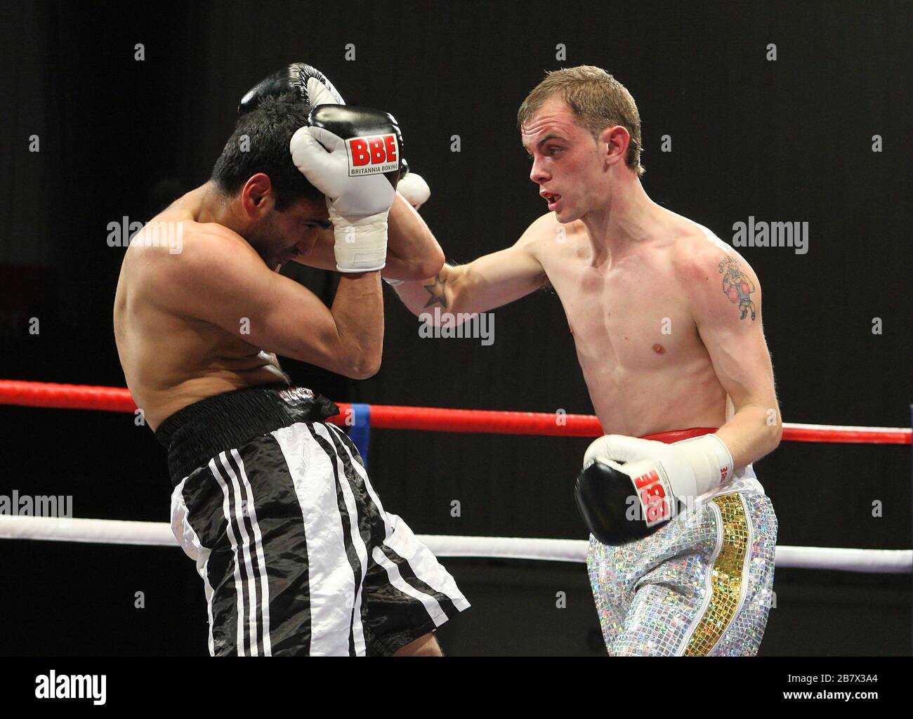 Leon Deans (white/gold shorts) defeats Sid Razak in a Lightweight ...