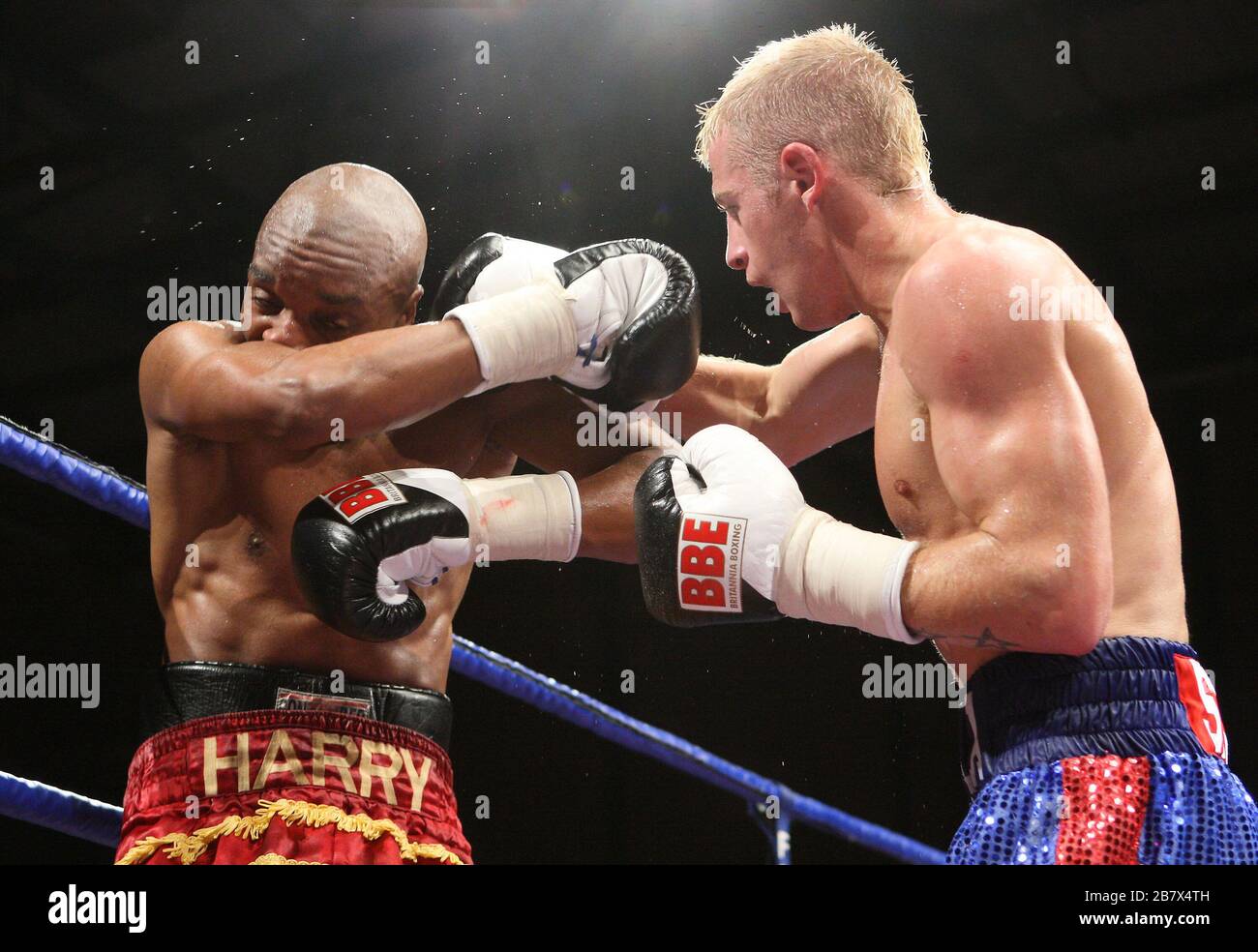Gary Sykes (Dewsbury, blue shorts) defeats Harry Ramogoadi (Rugby, red ...