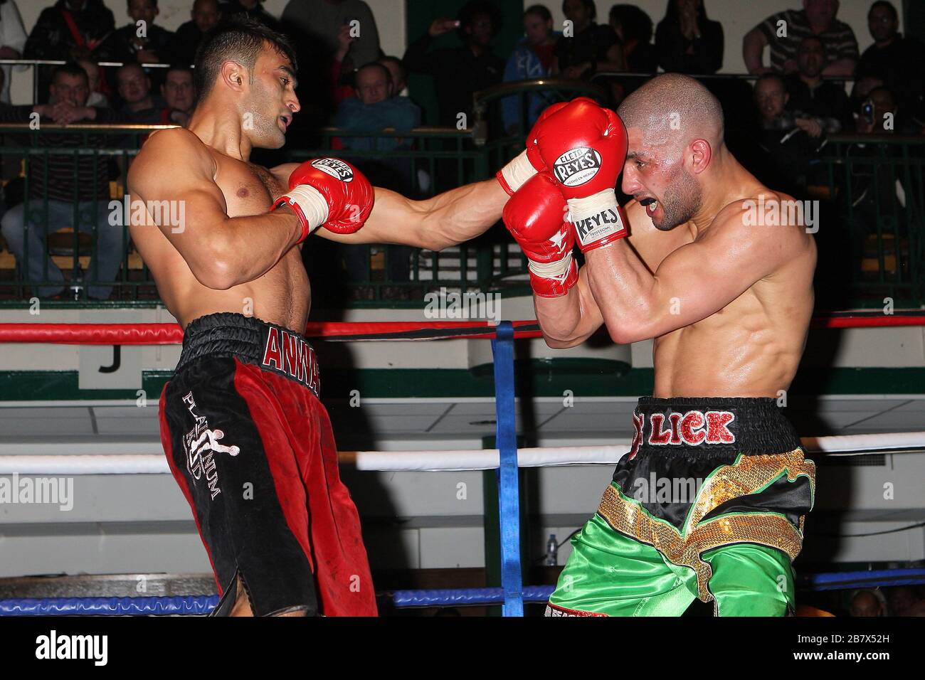 Adil Anwar (red/black shorts) defeats Nathan Graham in a Welterweight ...