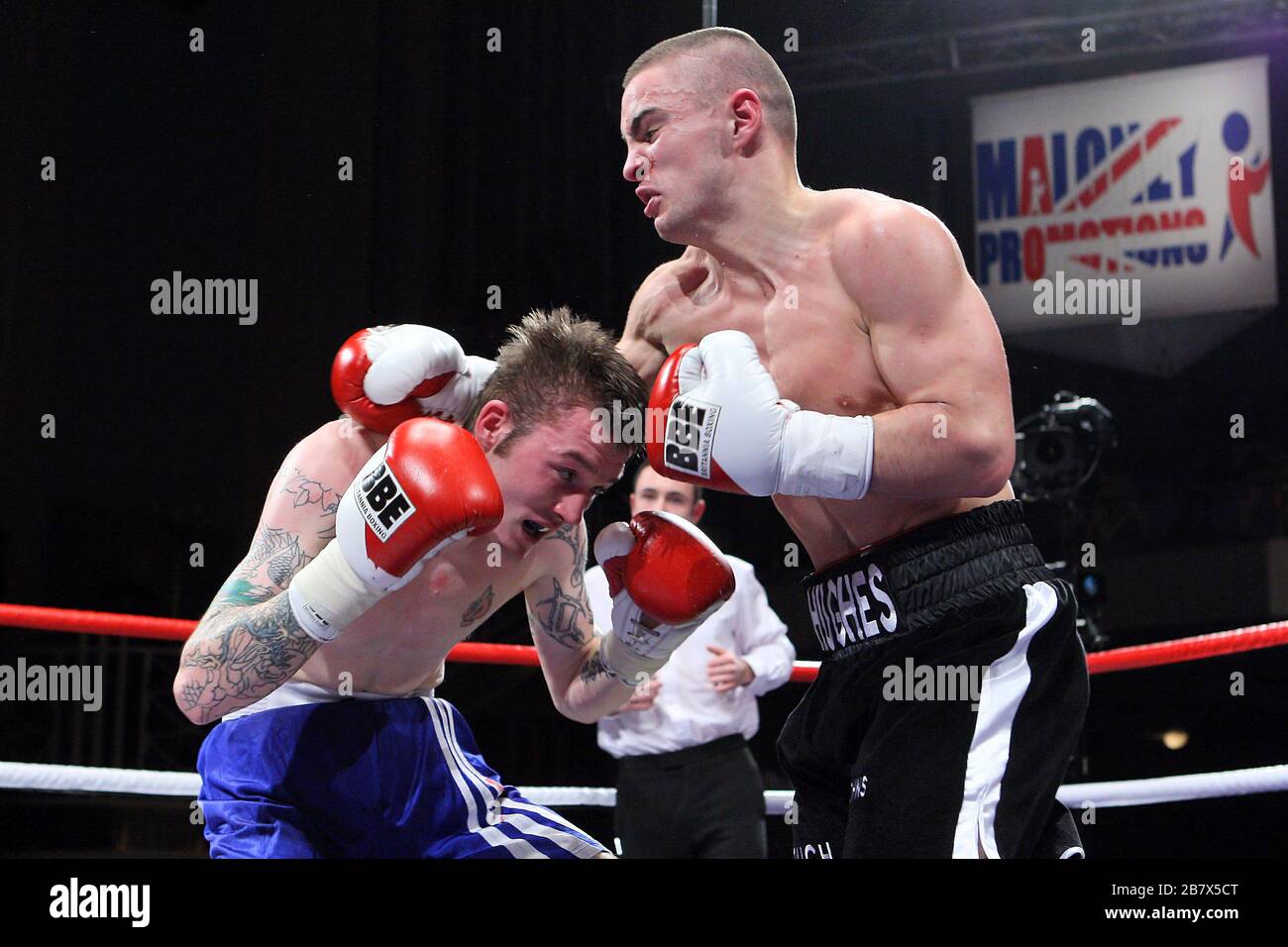 Joe Hughes (black shorts) defeats Jason Carr in a LightWelterweight ...