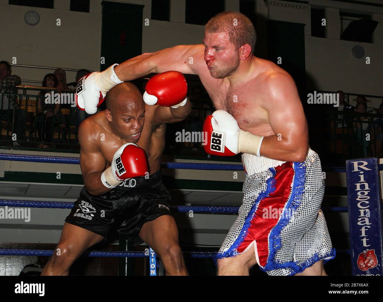 Leon Williams (black shorts) defeats Mark Lewis in a Cruiserweight ...