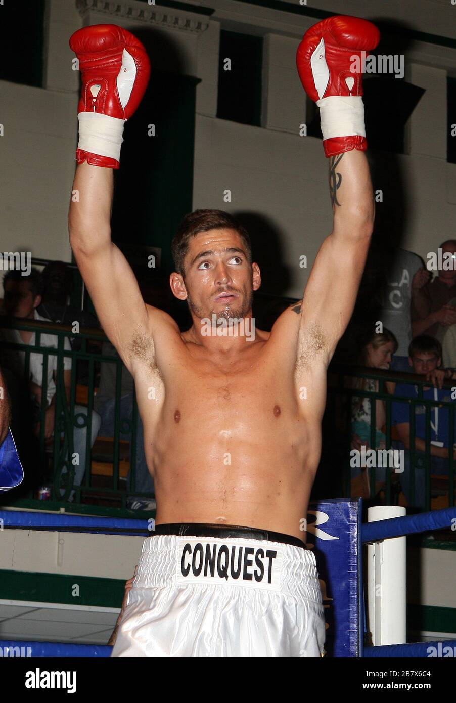 Tony Conquest, Tony Conquest (white shorts) defeats Bobby Scott in a ...