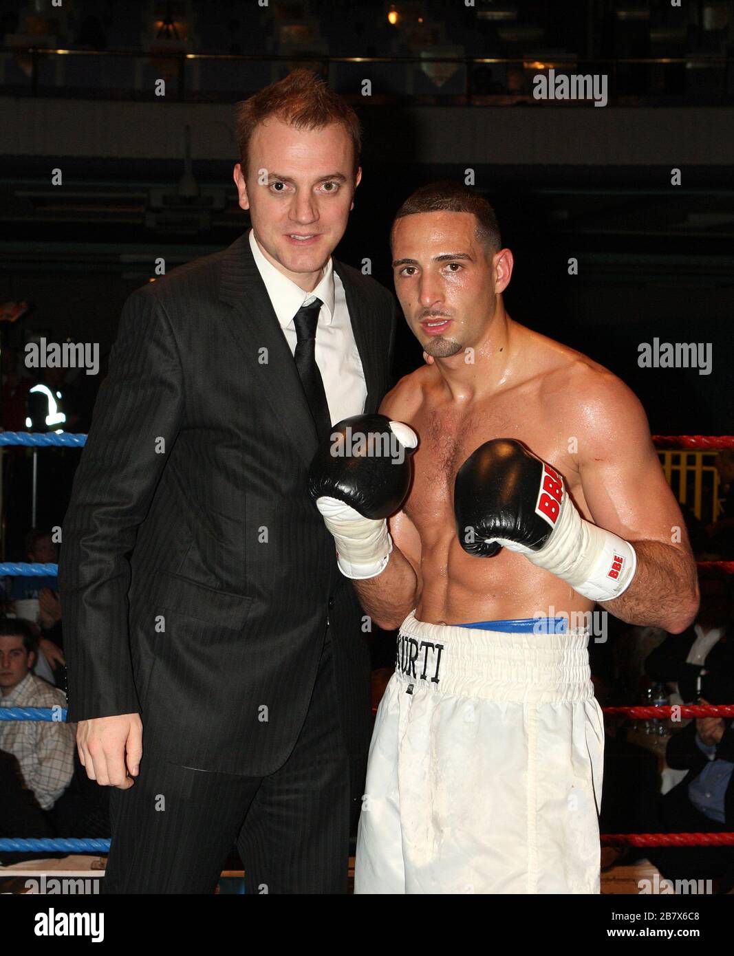 Eder Kurti (R) is pictured with Mickey Helliet, Eder Kurti (white shorts) defeats Matt Scriven ...