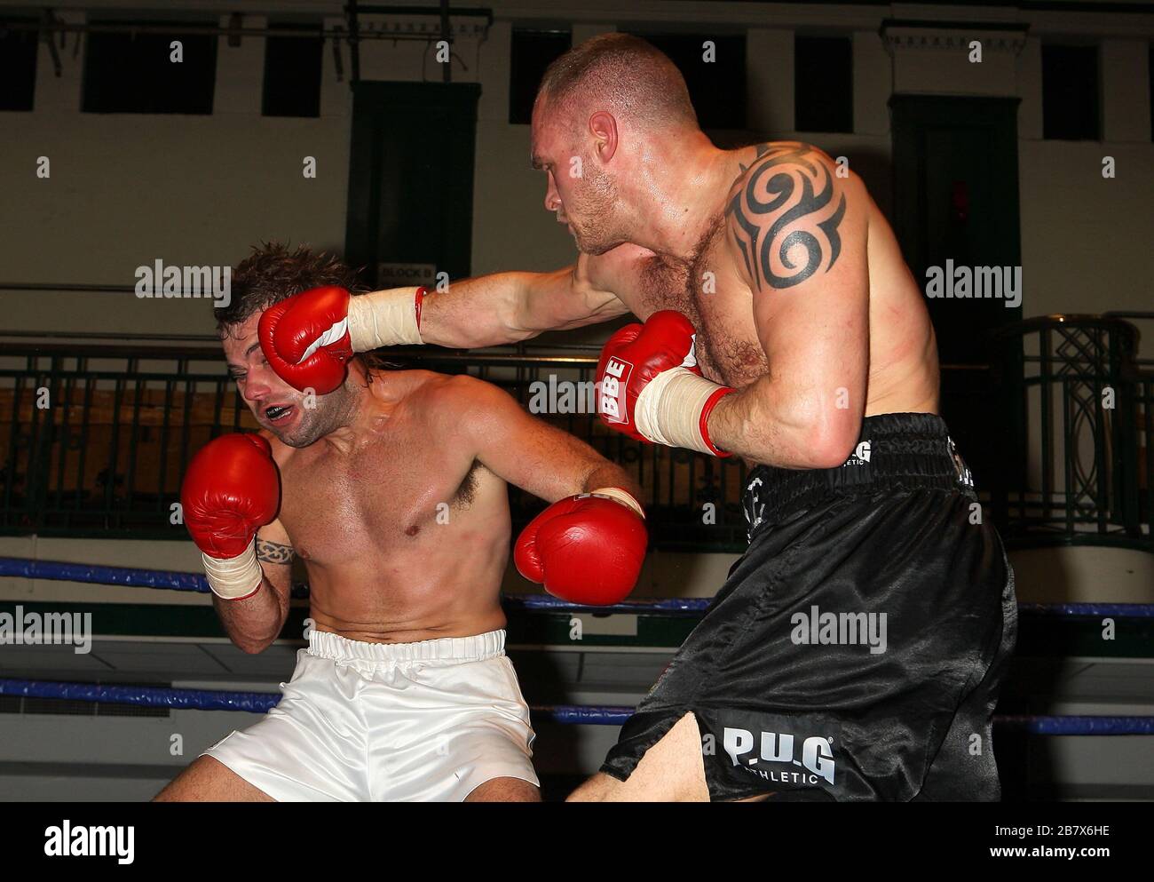 Caine Brodie (black shorts) defeats Adam Wilcox in a Light-Heavyweight ...