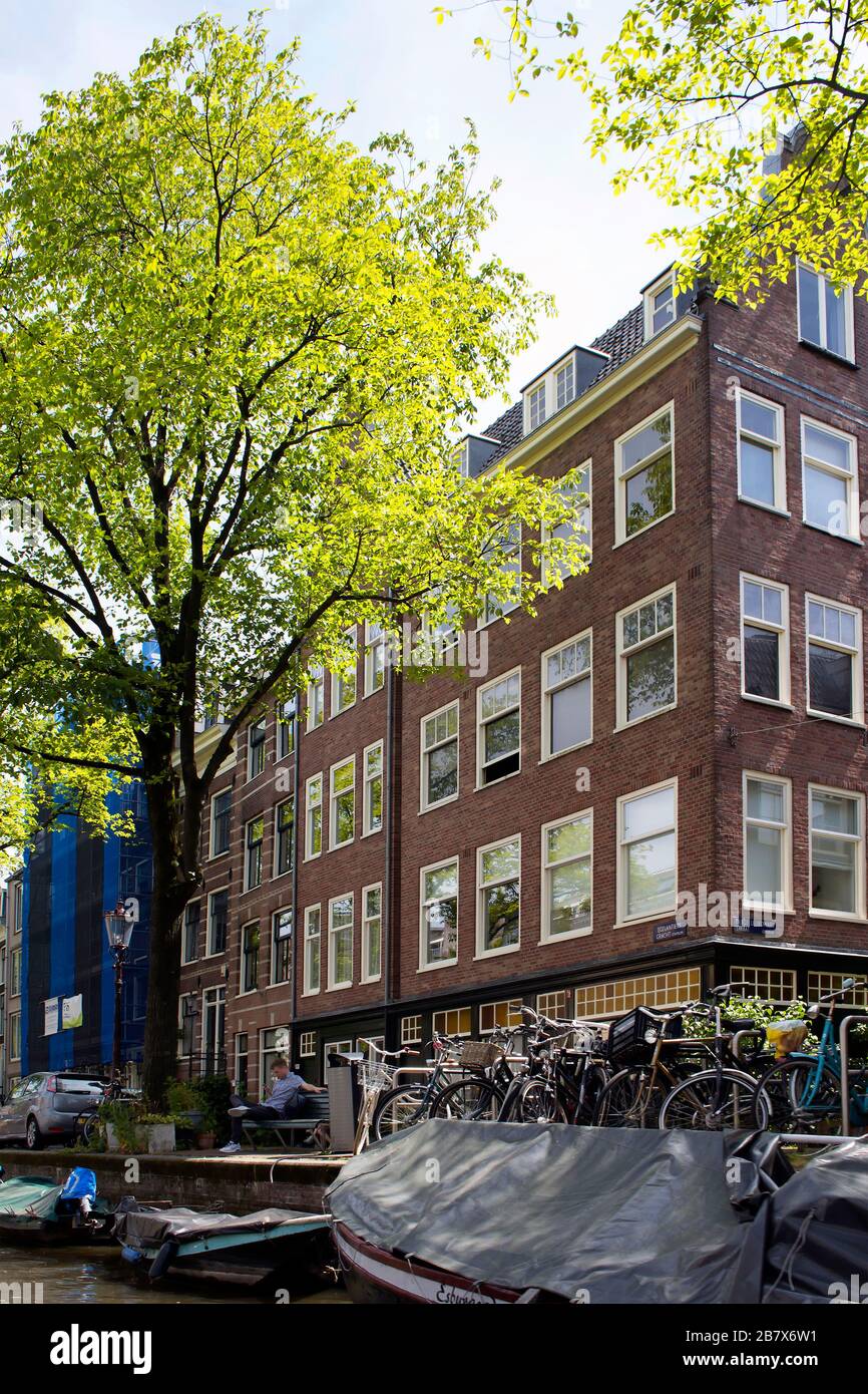 View of canal, trees, historical and traditional buildings showing ...