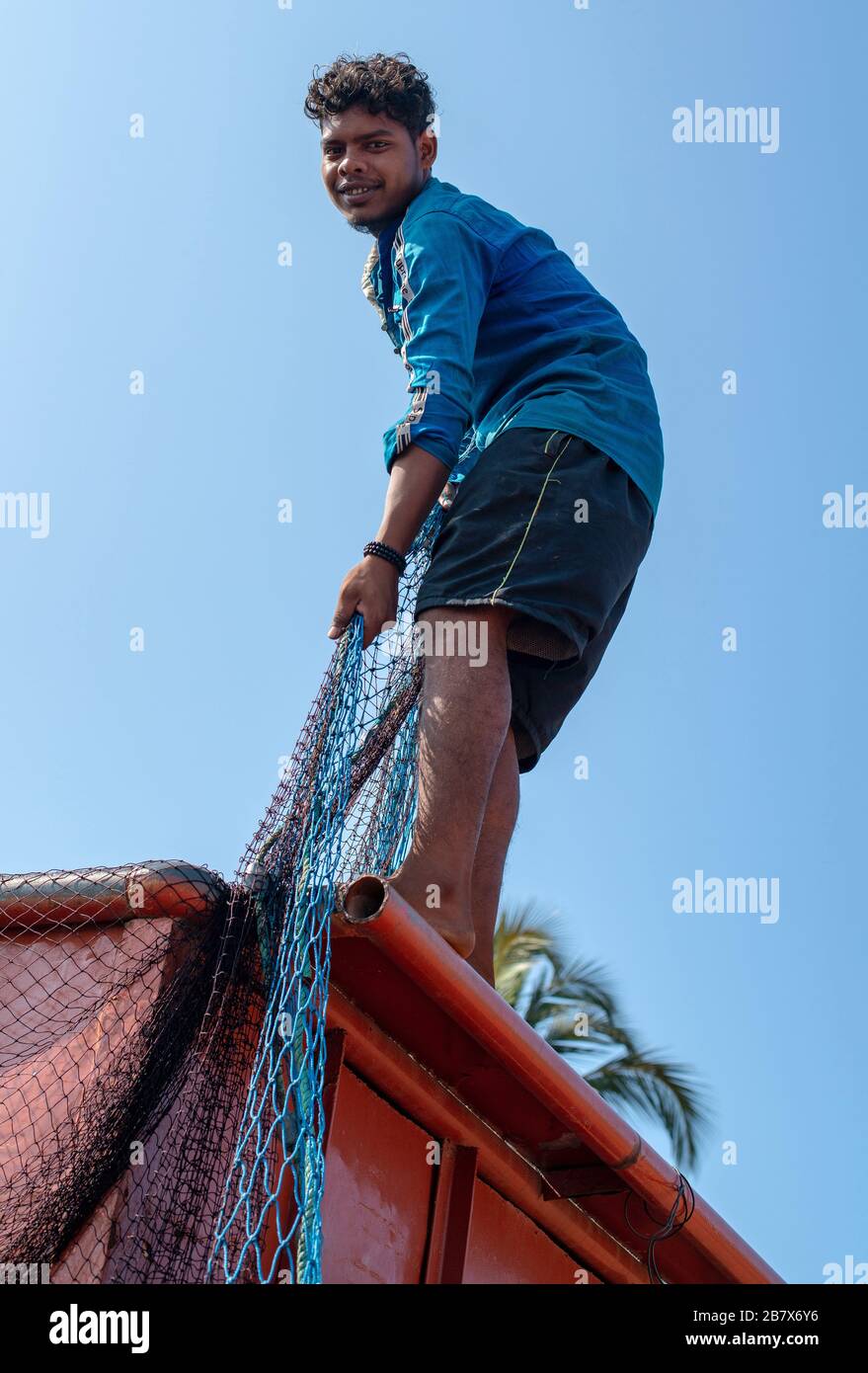 Fisherman haul up fishing nets Stock Photo - Alamy