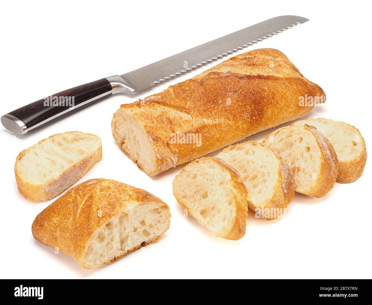 French baguette cut in pieces isolated on white Stock Photo - Alamy
