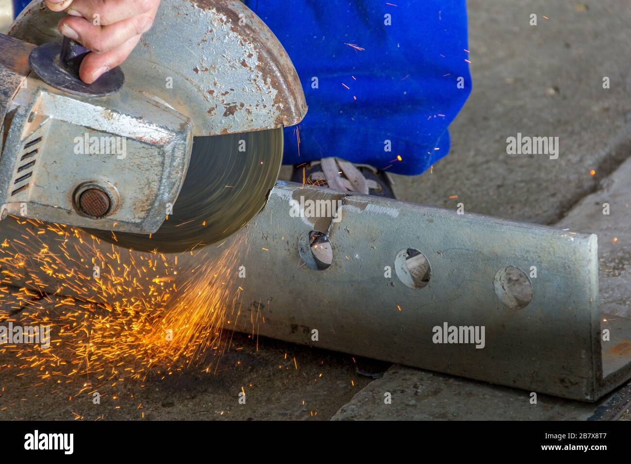 worker with angle grinder cutting steel Stock Photo - Alamy
