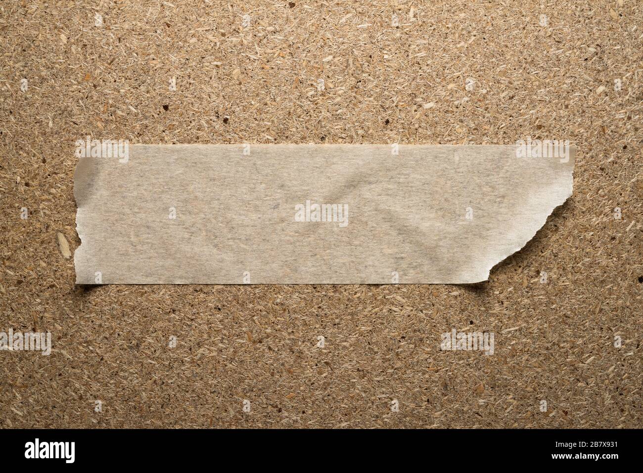 Paper tape on a chipboard table Stock Photo - Alamy