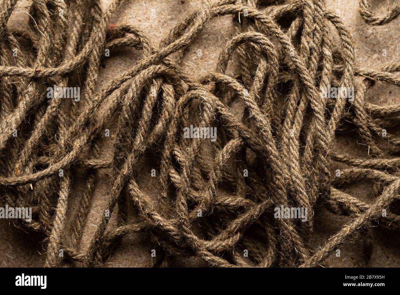 Tangled rope. Jute cable background Stock Photo - Alamy
