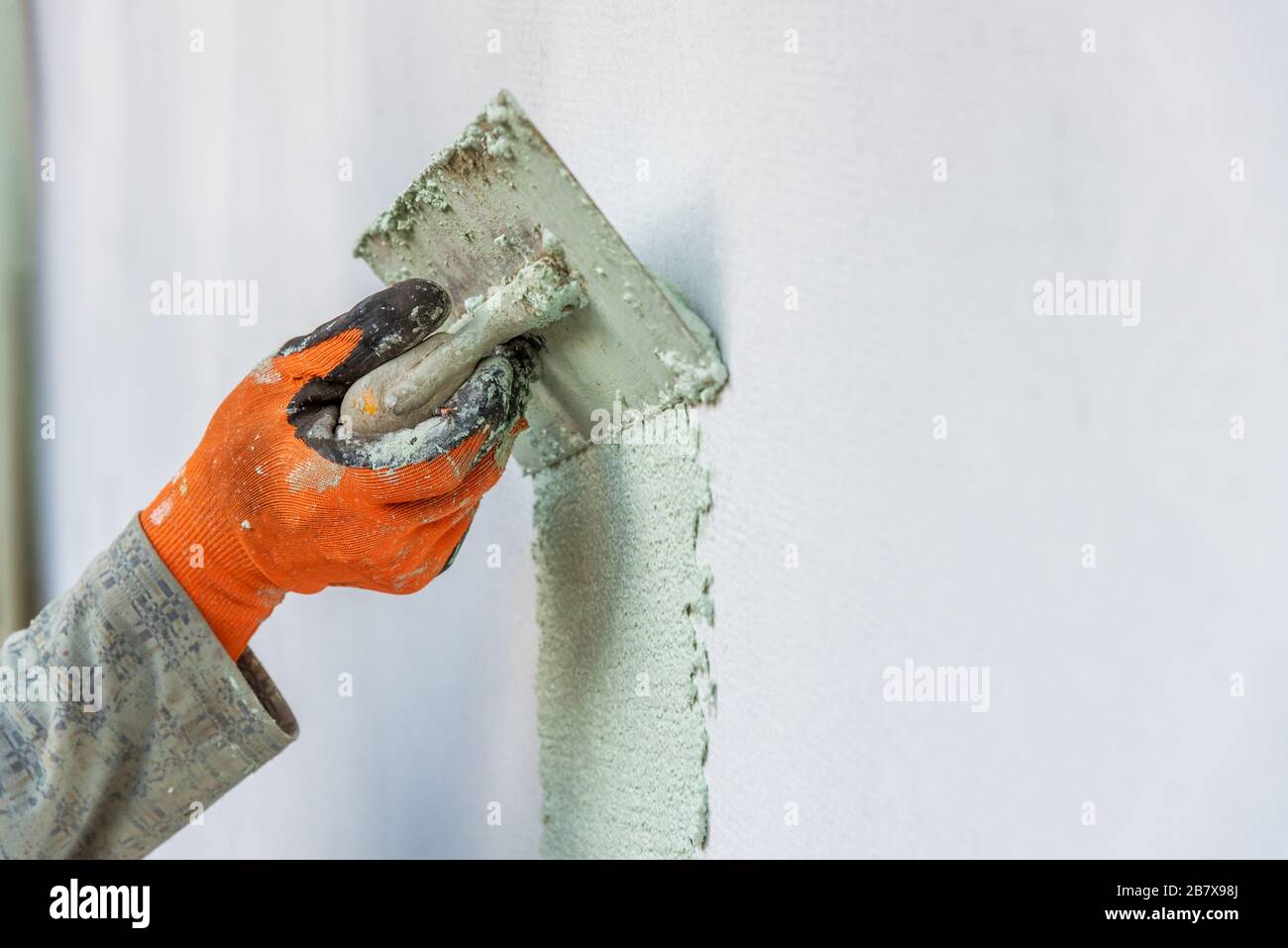 Application Of Facade Plaster,worker Plastering The Facade Of The ...