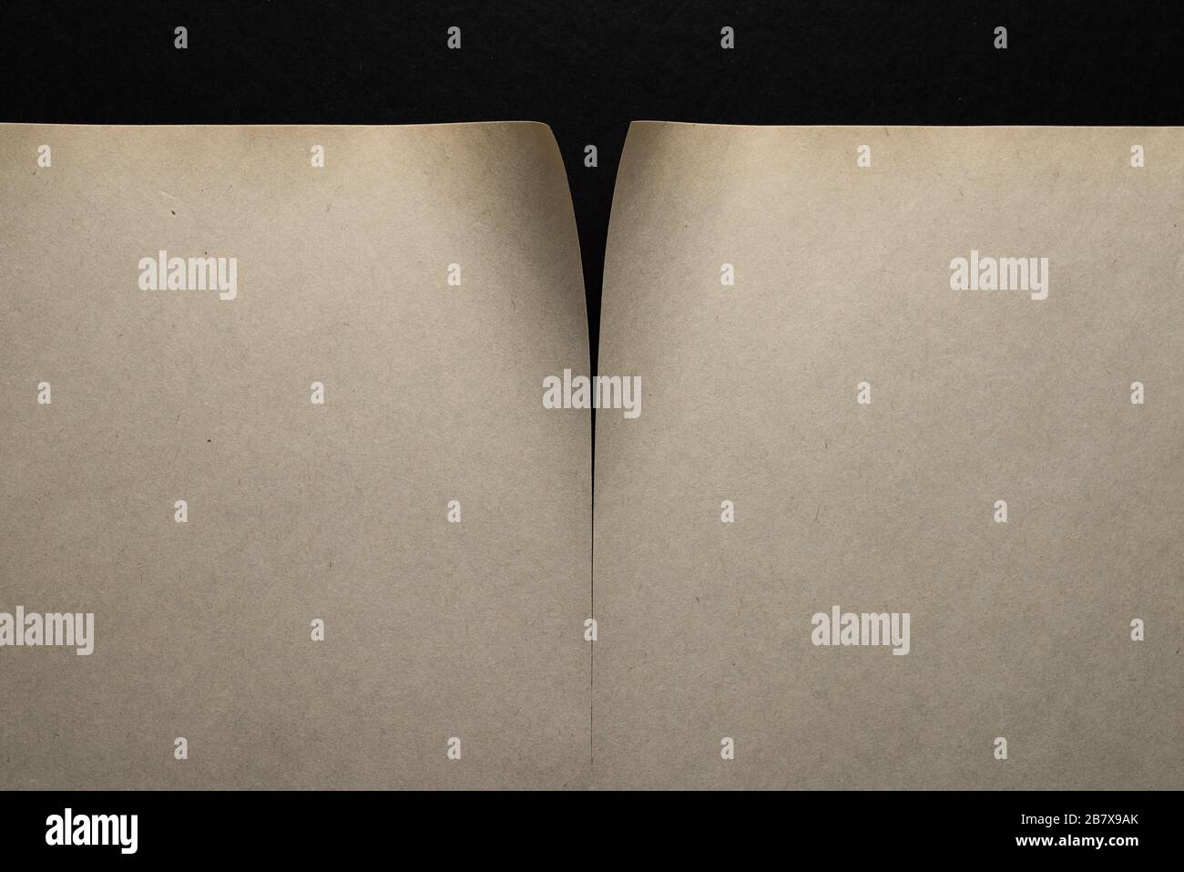 A neat cut of a brown sheet of paper Stock Photo - Alamy