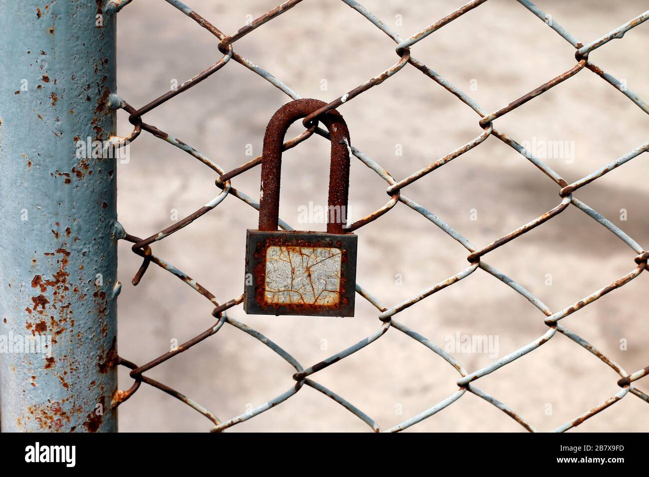old key lock on the metal fence Stock Photo - Alamy