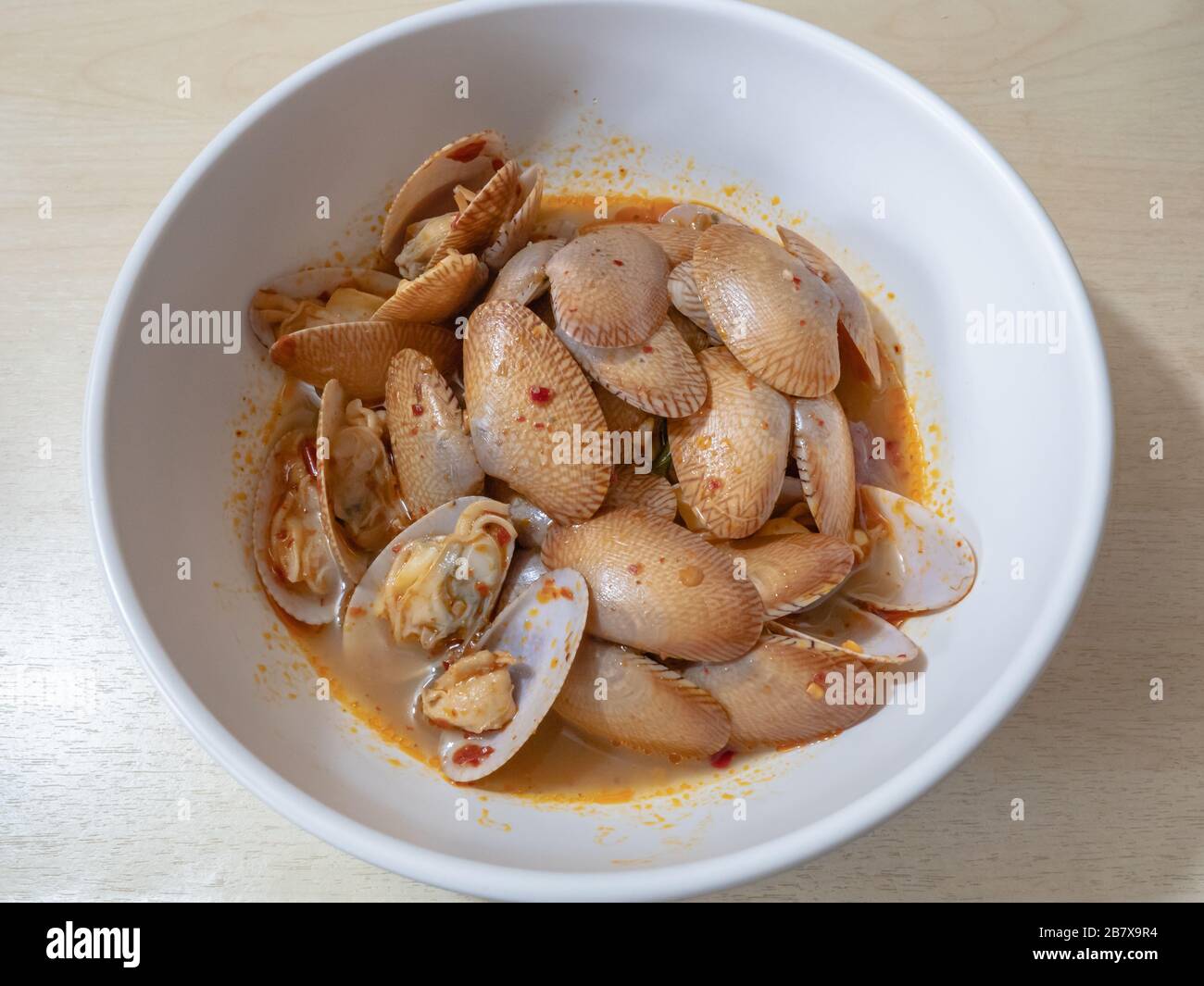 The close up of Thai Stir Fried Clams with Roasted Chili Paste on white ...