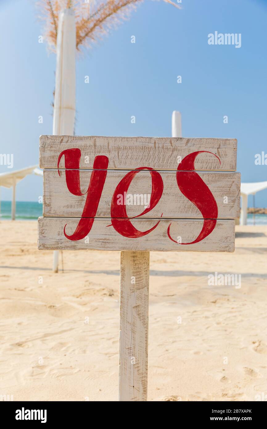 Word yes on the information board on the beach Stock Photo - Alamy