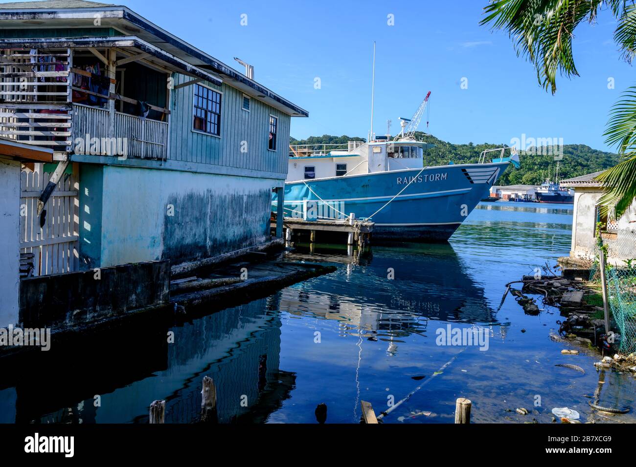 Boat moored at harbor, French Harbour, Roatan, Honduras Stock Photo - Alamy