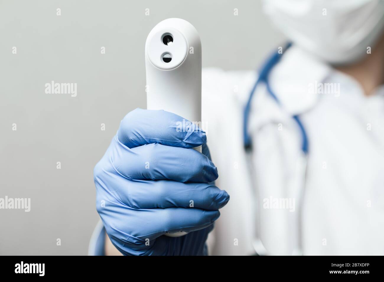 Close-up shot of doctor wearing protective surgical mask ready to use ...