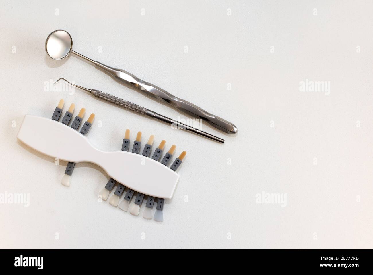 Plastic Dental implant to choose color tone of teeth Stock Photo - Alamy