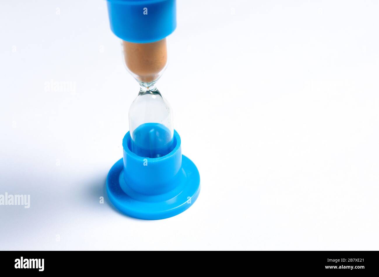 Time stopped in the hourglass. Medical hourglass. Measuring time in a ...