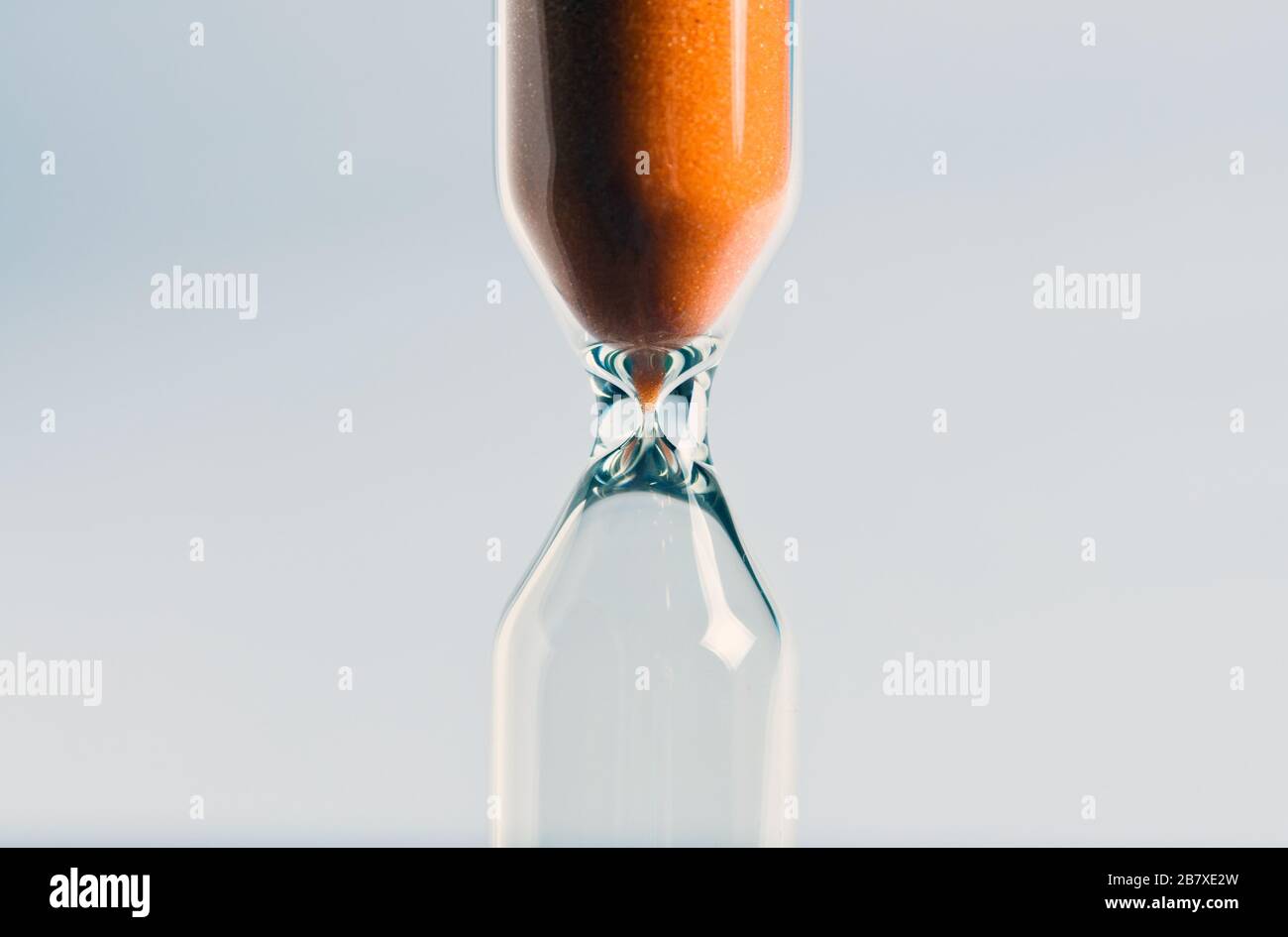 Time stopped in the hourglass. Medical hourglass. Measuring time in a ...