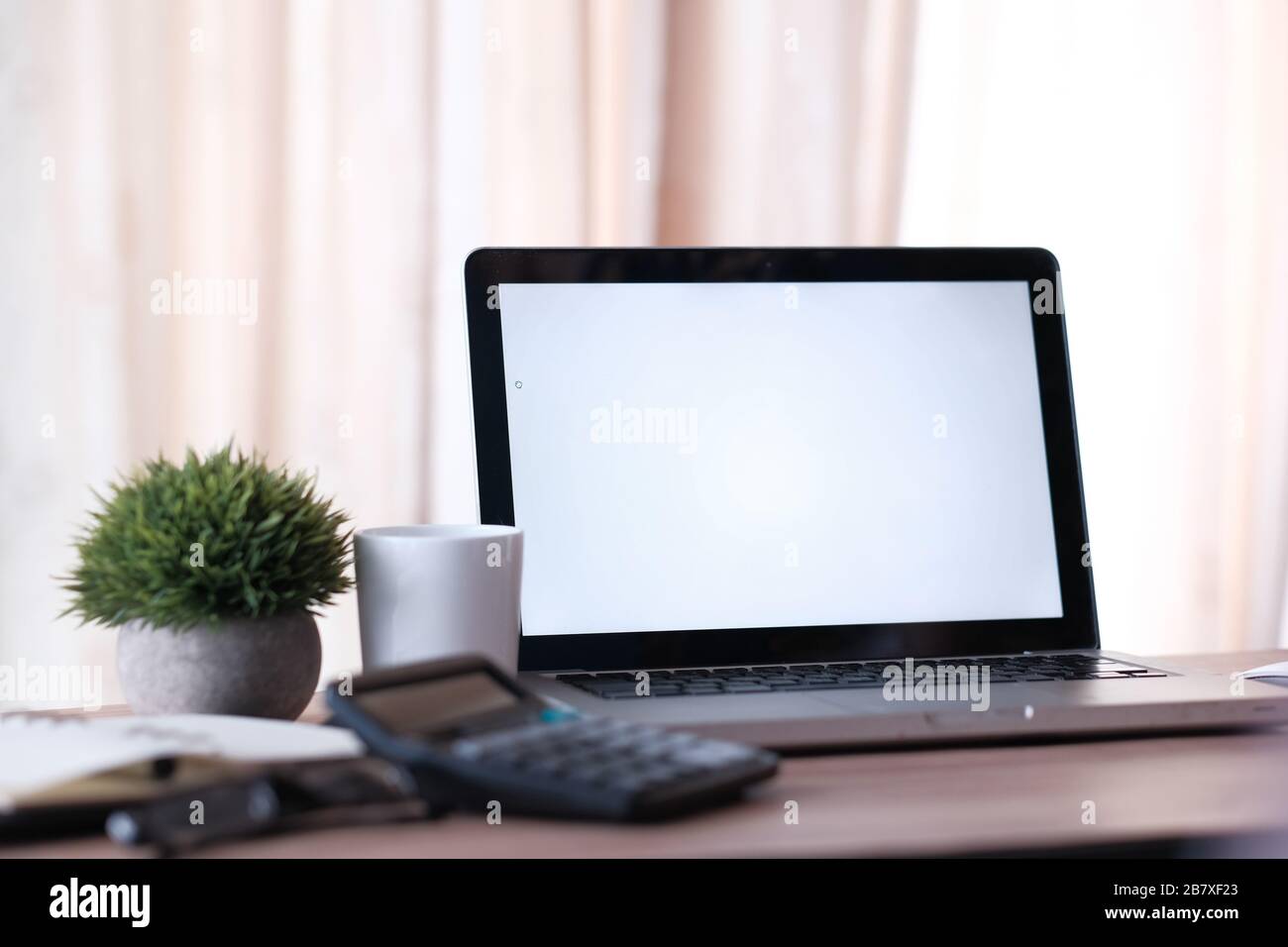 laptop with white screen on office table Stock Photo - Alamy