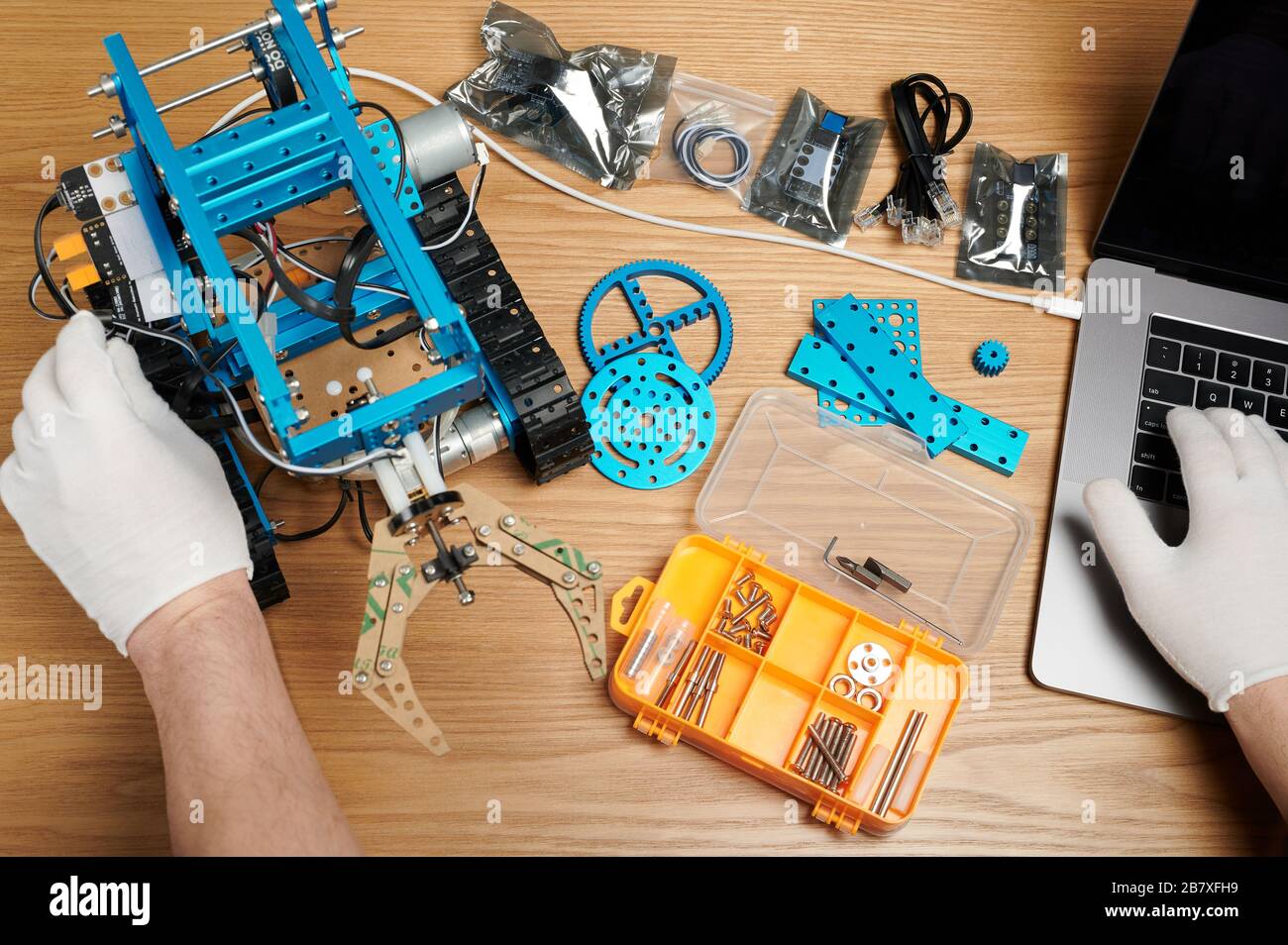 Student assemble robot and connect to laptop above top view Stock Photo ...