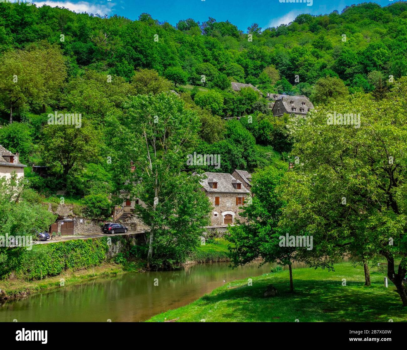 Belcastel medieval town, Aveyron river, and green forest with sunlight ...