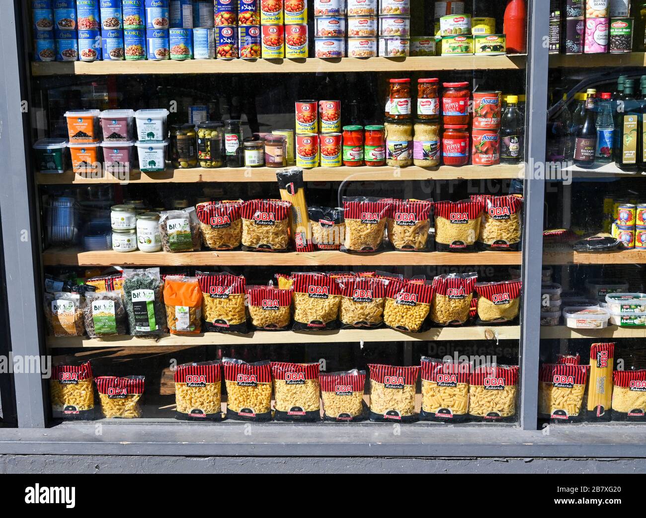 Corner shop in Brighton with packs of dried pasta in window during ...