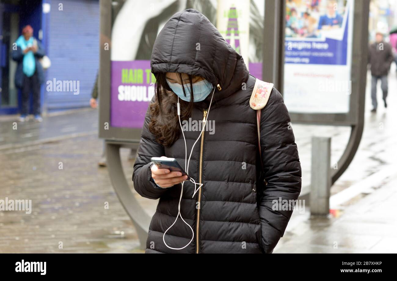 Woman wearing surgical mask hi-res stock photography and images - Alamy