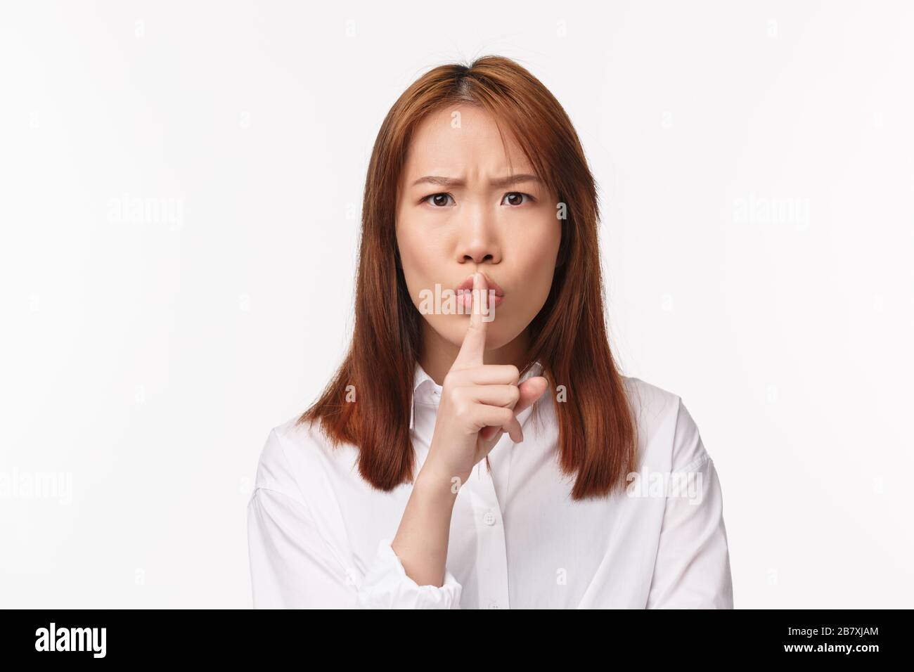 Asian woman shushing hi-res stock photography and images - Alamy