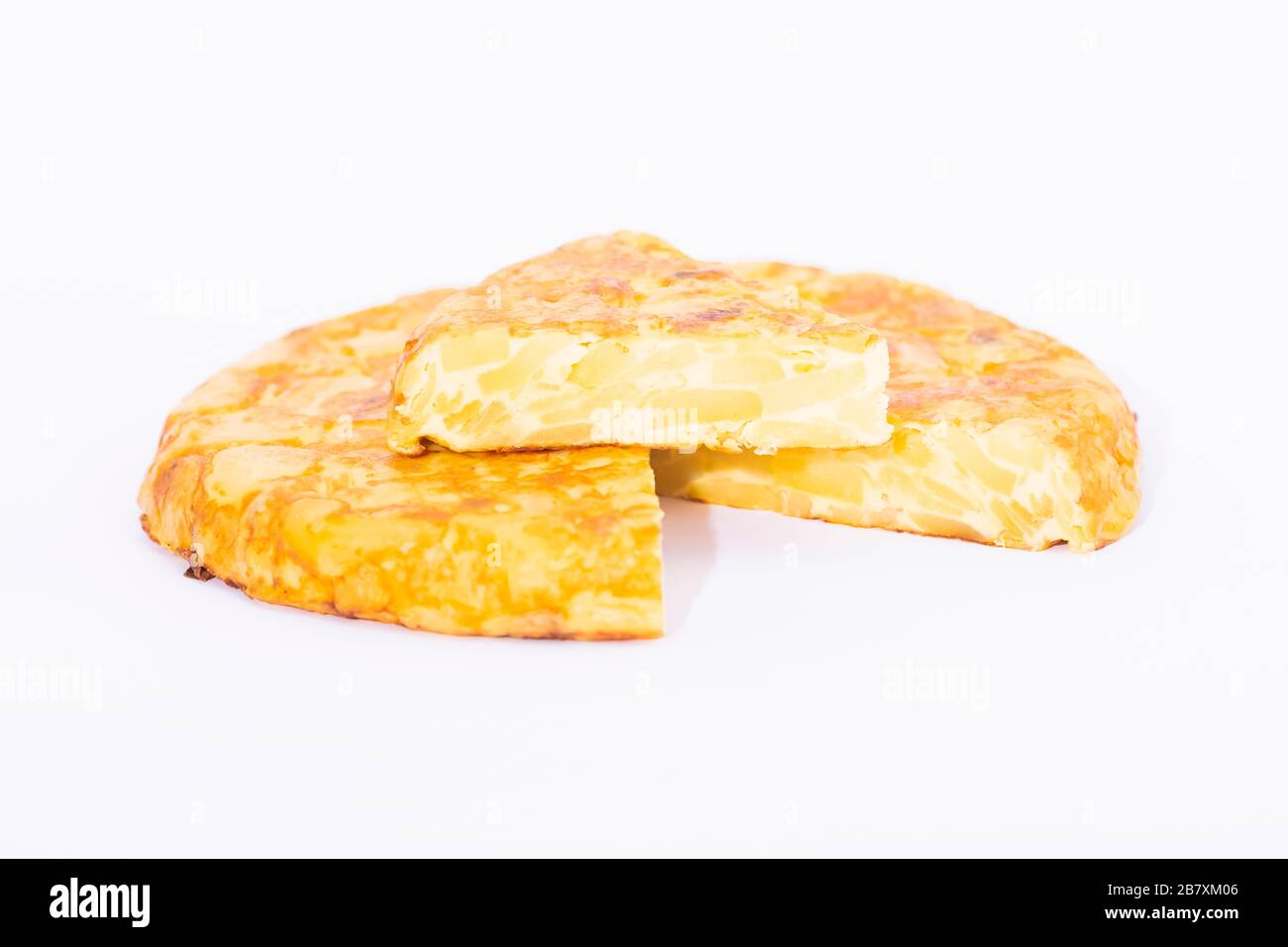 Traditional spanish omelet with a slice on top Stock Photo - Alamy