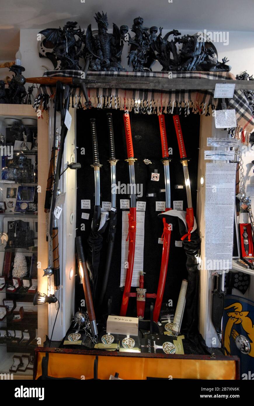 A shop with a display of Japanese swords and other weapons on sale in a ...