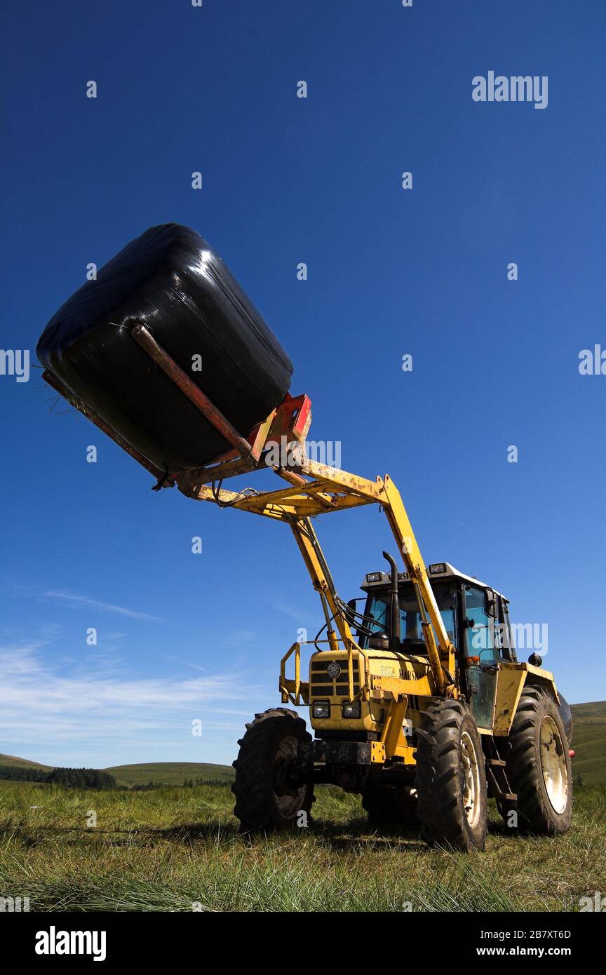 Tractor with bale lifter hi-res stock photography and images - Alamy