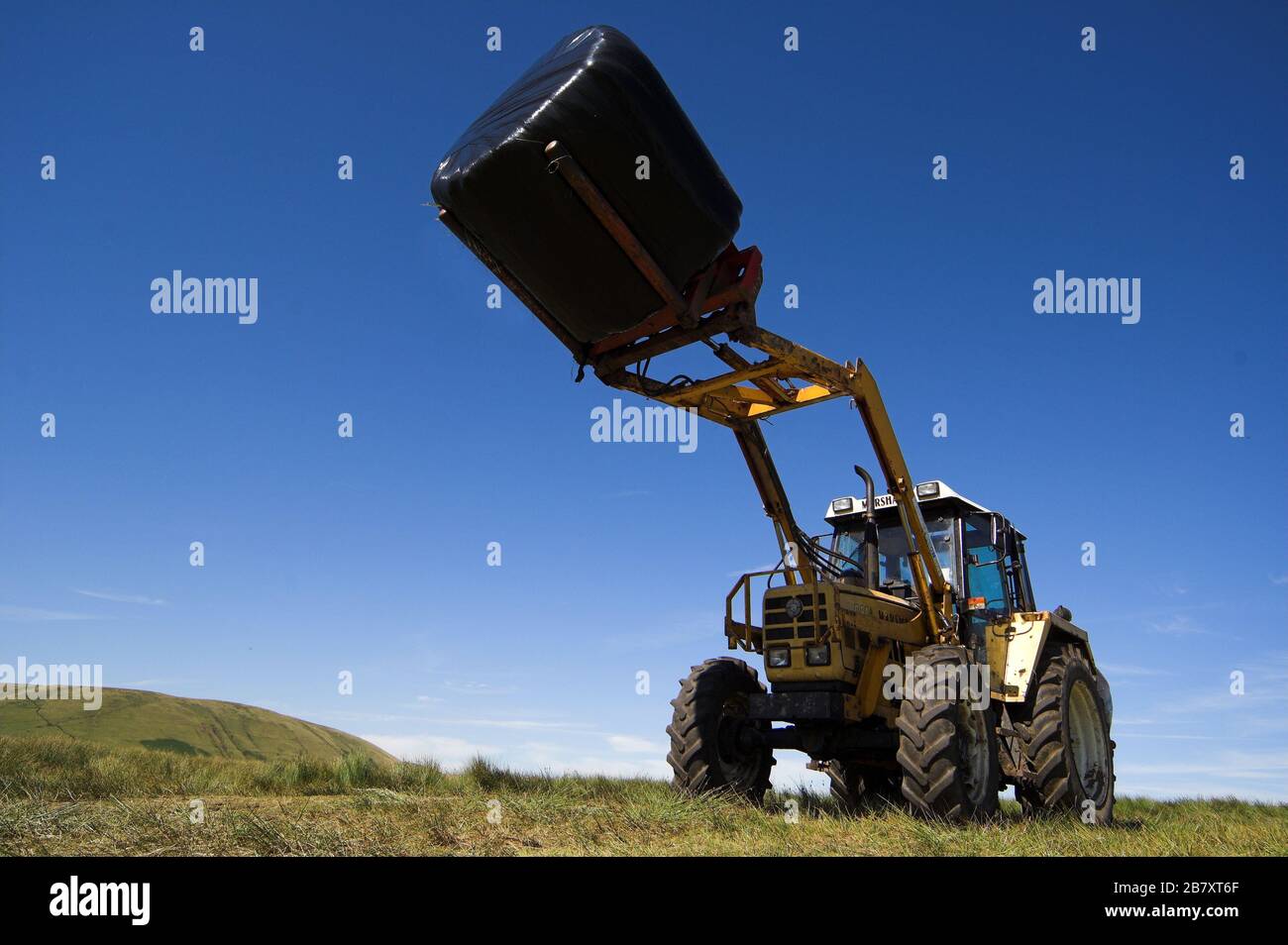 Tractor with bale lifter hi-res stock photography and images - Alamy