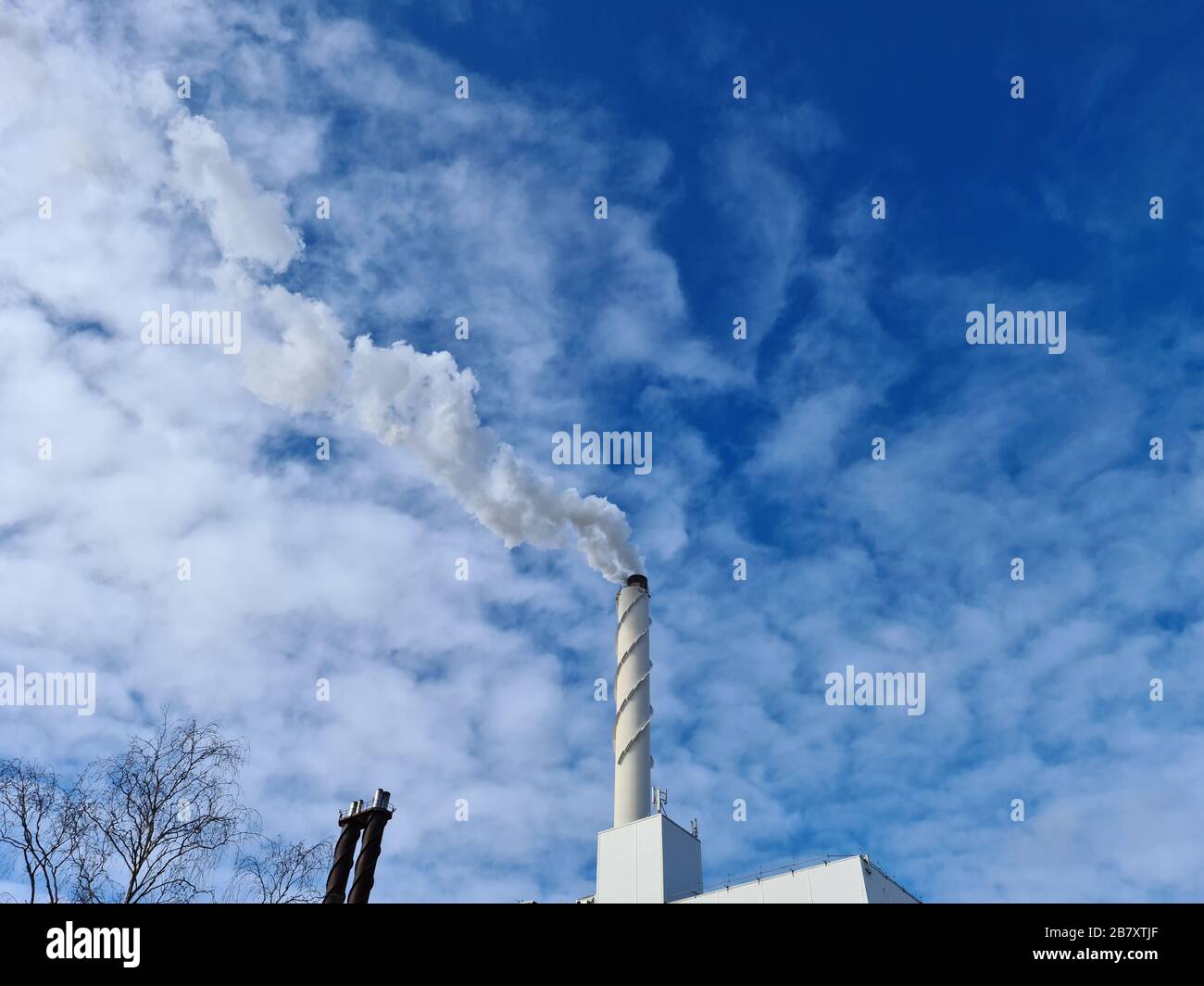 View of white smoke from chimney on blue sky background. Ecology and ...