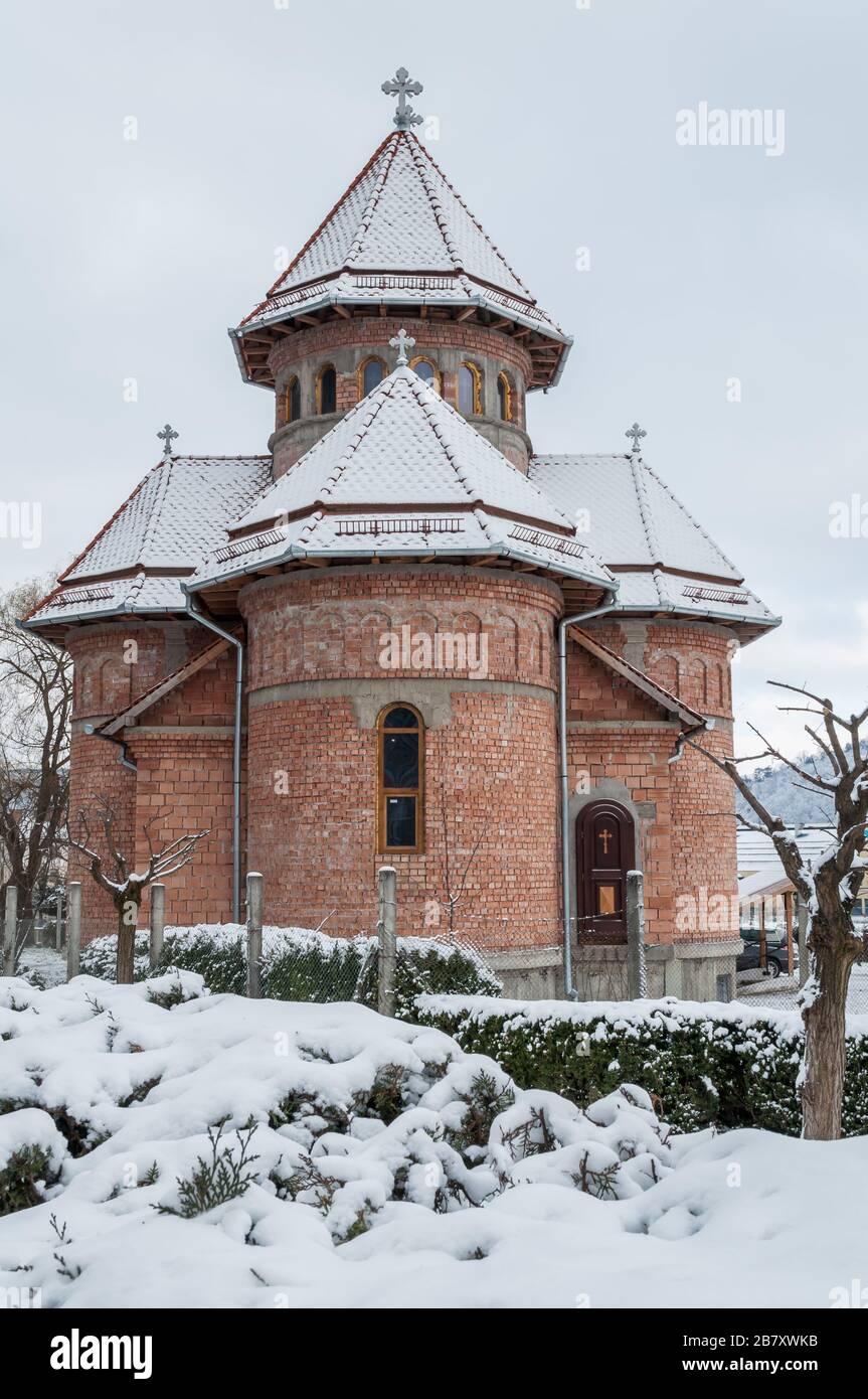 Church made of bricks. Rooftop covered with snow. Winter scene Stock ...