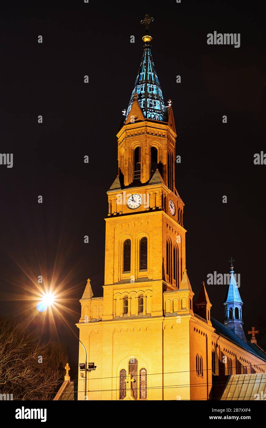belfry of neo-Gothic brick Catholic church at night in Poznan Stock ...